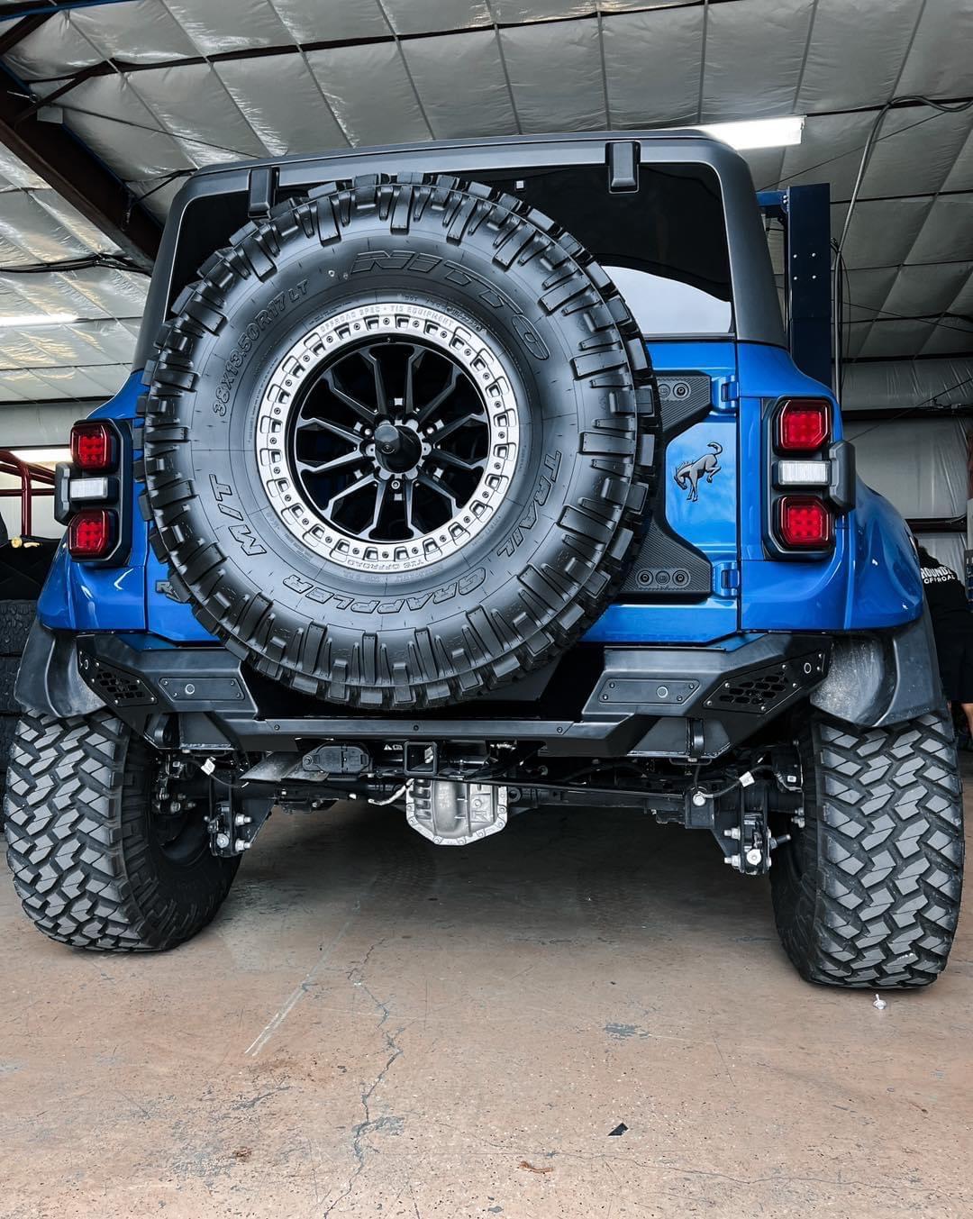Velocity Blue Bronco Raptor on RPG perch collar lift, 38's and painted ...