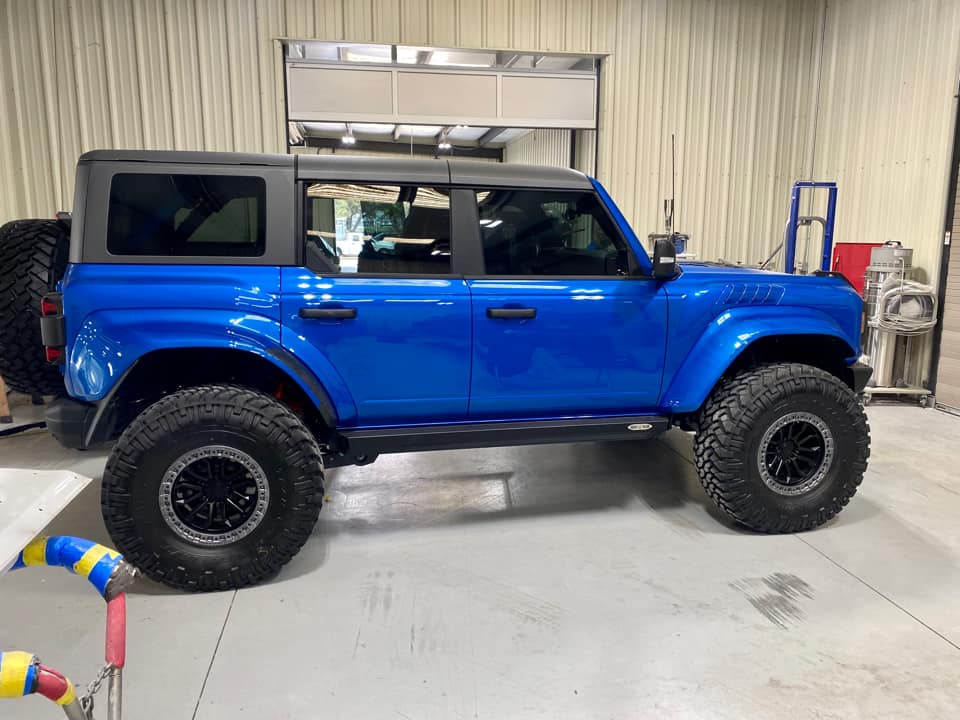 Velocity Blue Bronco Raptor on RPG perch collar lift, 38's and painted ...